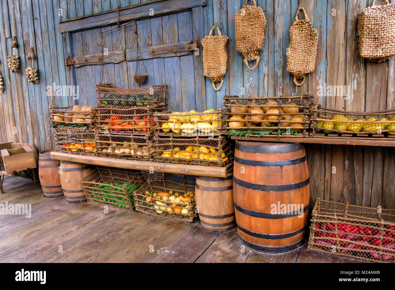 Old trading post with wooden walls, barrels, crates, baskets, scales ...