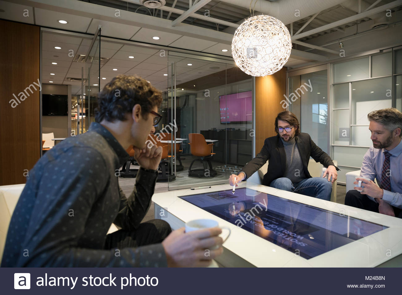 Group three businessmen conference table hi-res stock photography and ...
