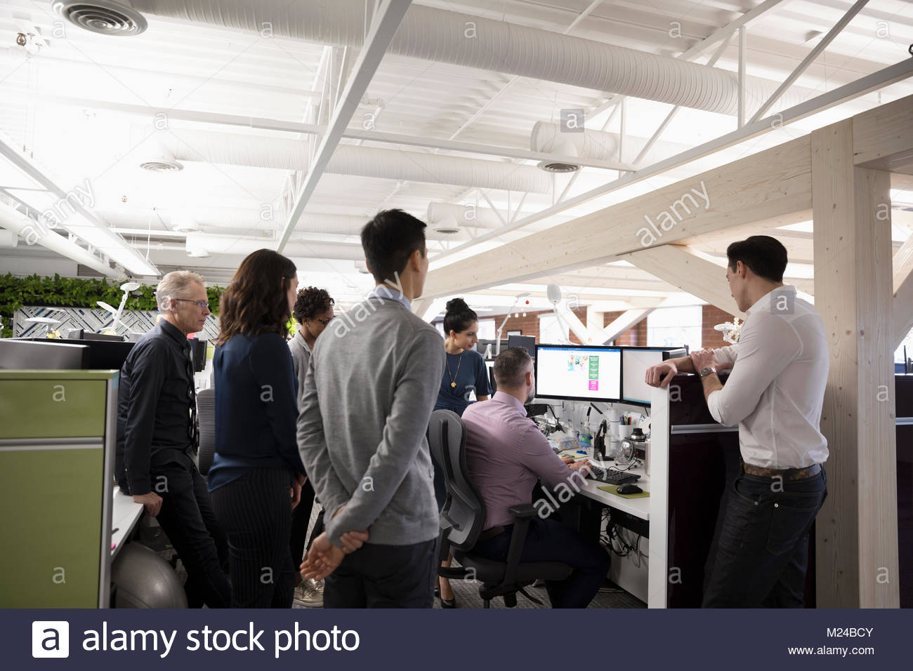 Business people working, meeting at computer in office cubicle Stock ...