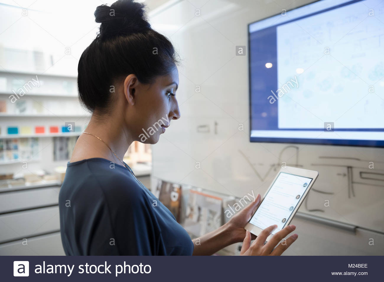 Designer using digital tablet at screen in creative office Stock Photo ...