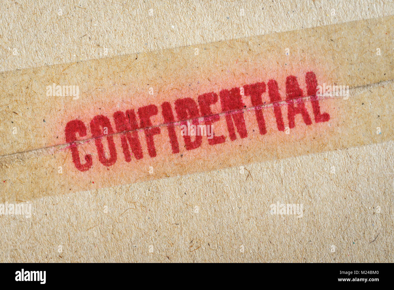 Red "Confidential" word printed on brown vintage envelope Stock Photo ...