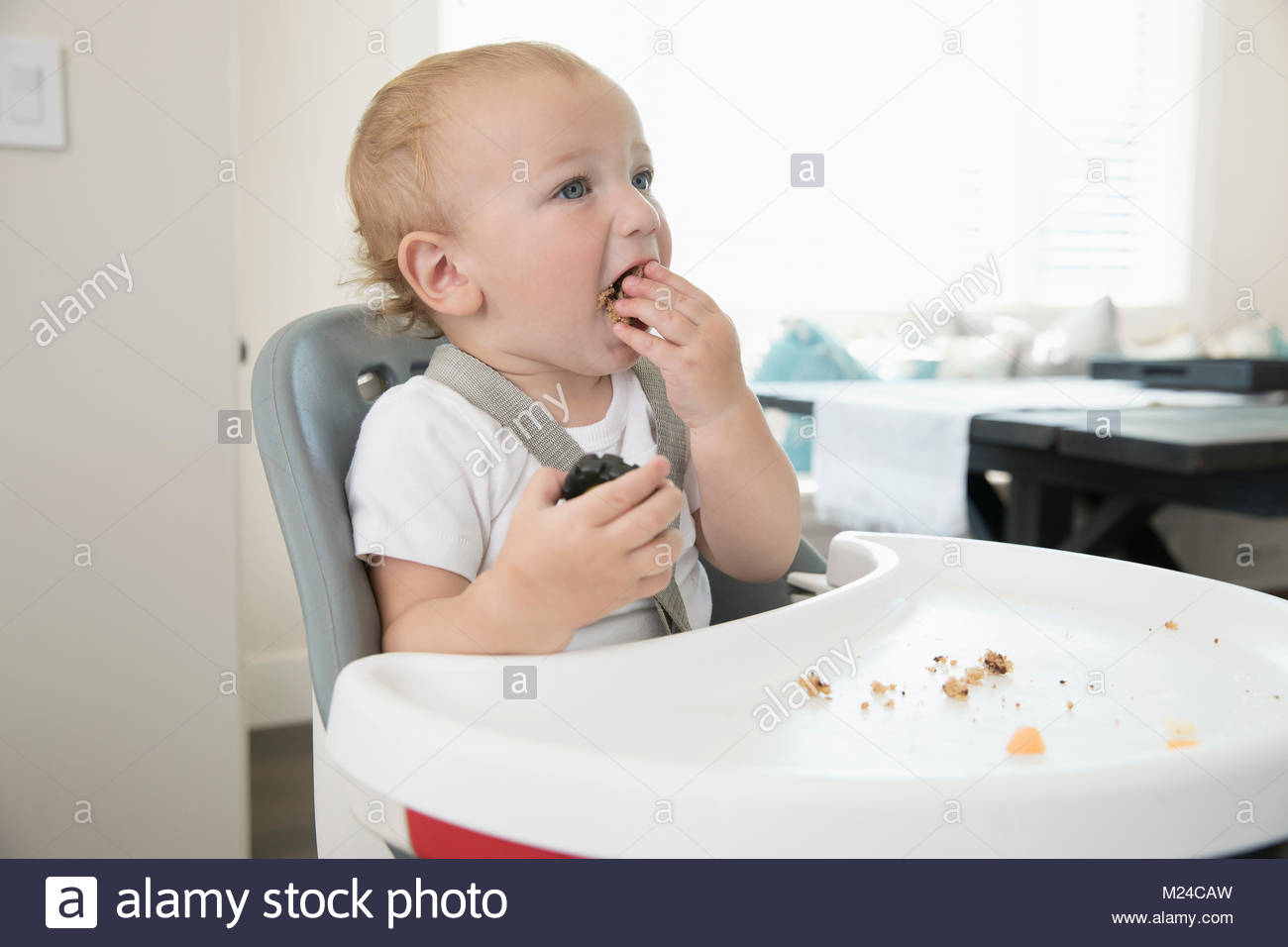 Baby the chair eating his food hi-res stock photography and images - Alamy