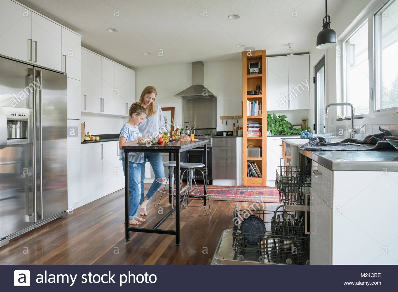 Mother son cooking in kitchen hi-res stock photography and images - Alamy