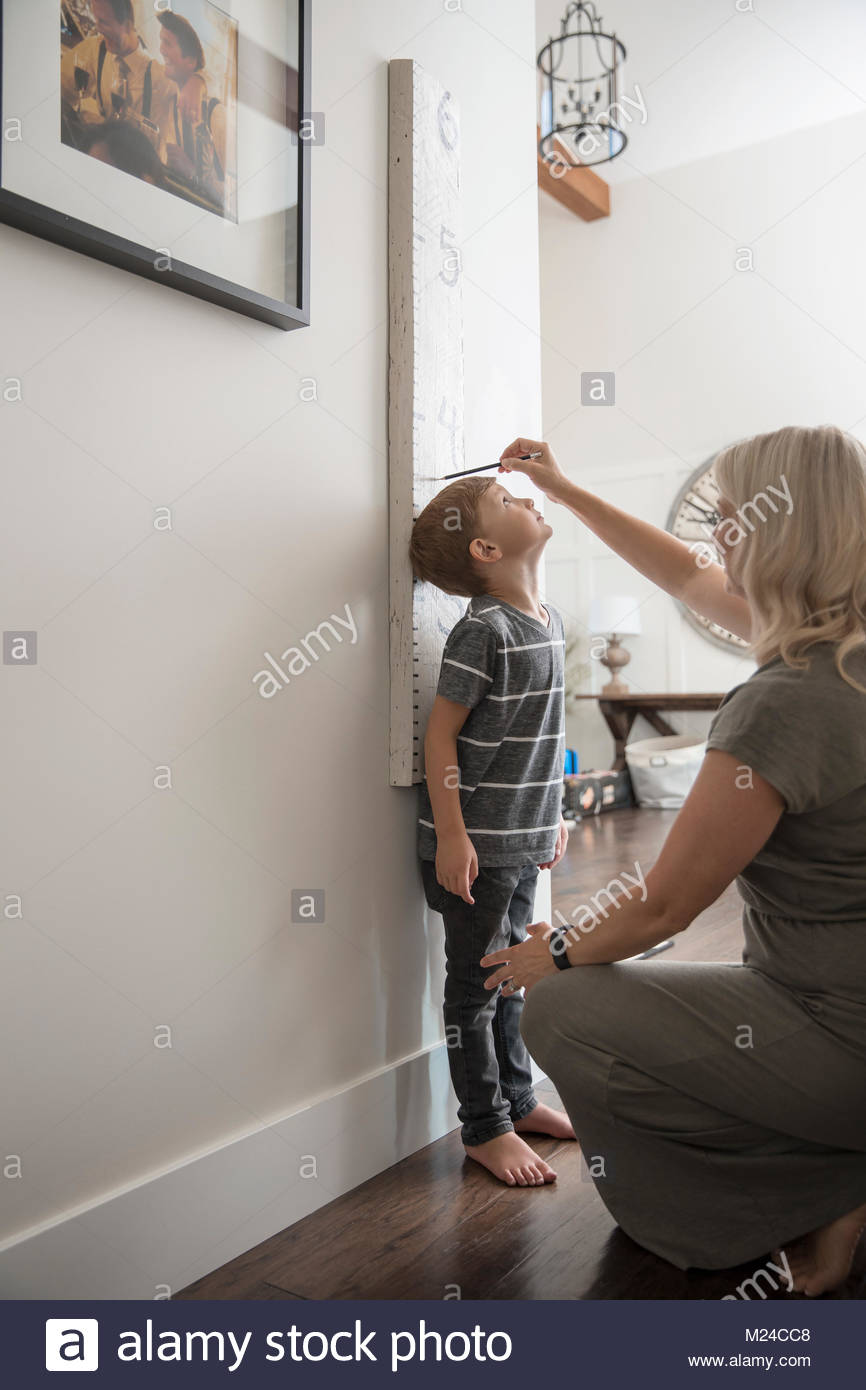 Boy measuring height hi-res stock photography and images - Alamy