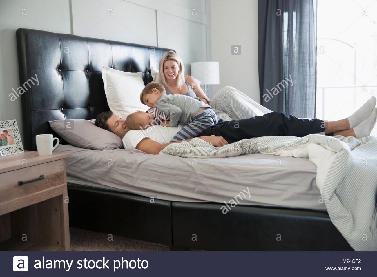 Cute couple laying down on hi-res stock photography and images - Alamy