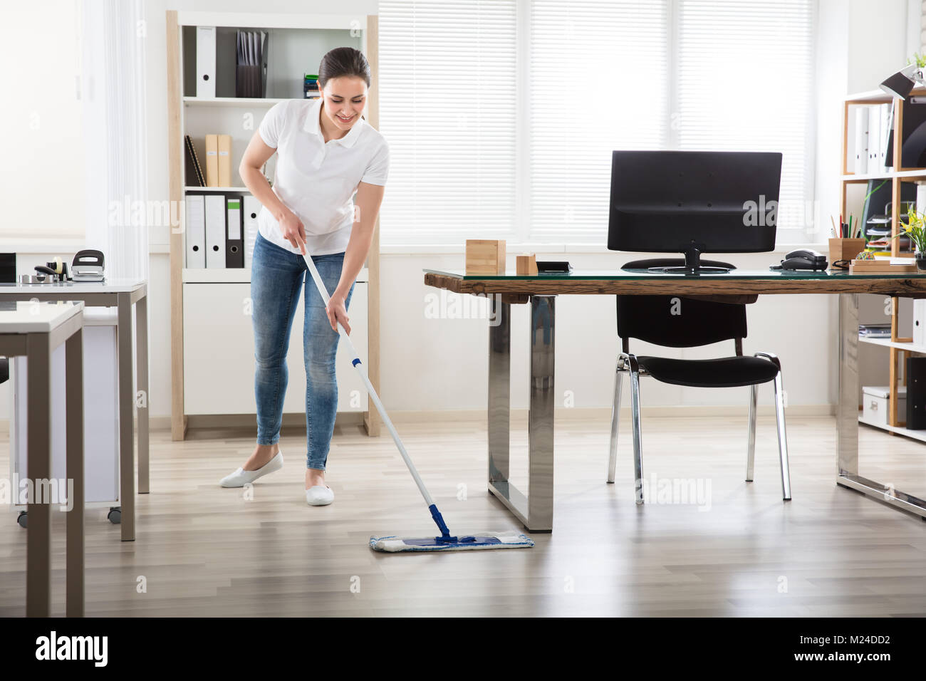 Woman floor office cleaning hi-res stock photography and images - Alamy