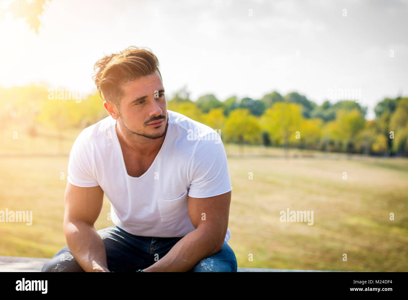 Man in city park Stock Photo - Alamy