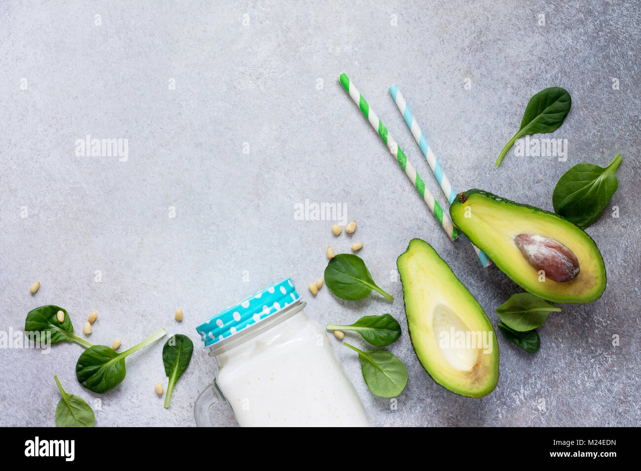 Mug Mason jar with a refreshing milkshake green spinach and pine nuts ...