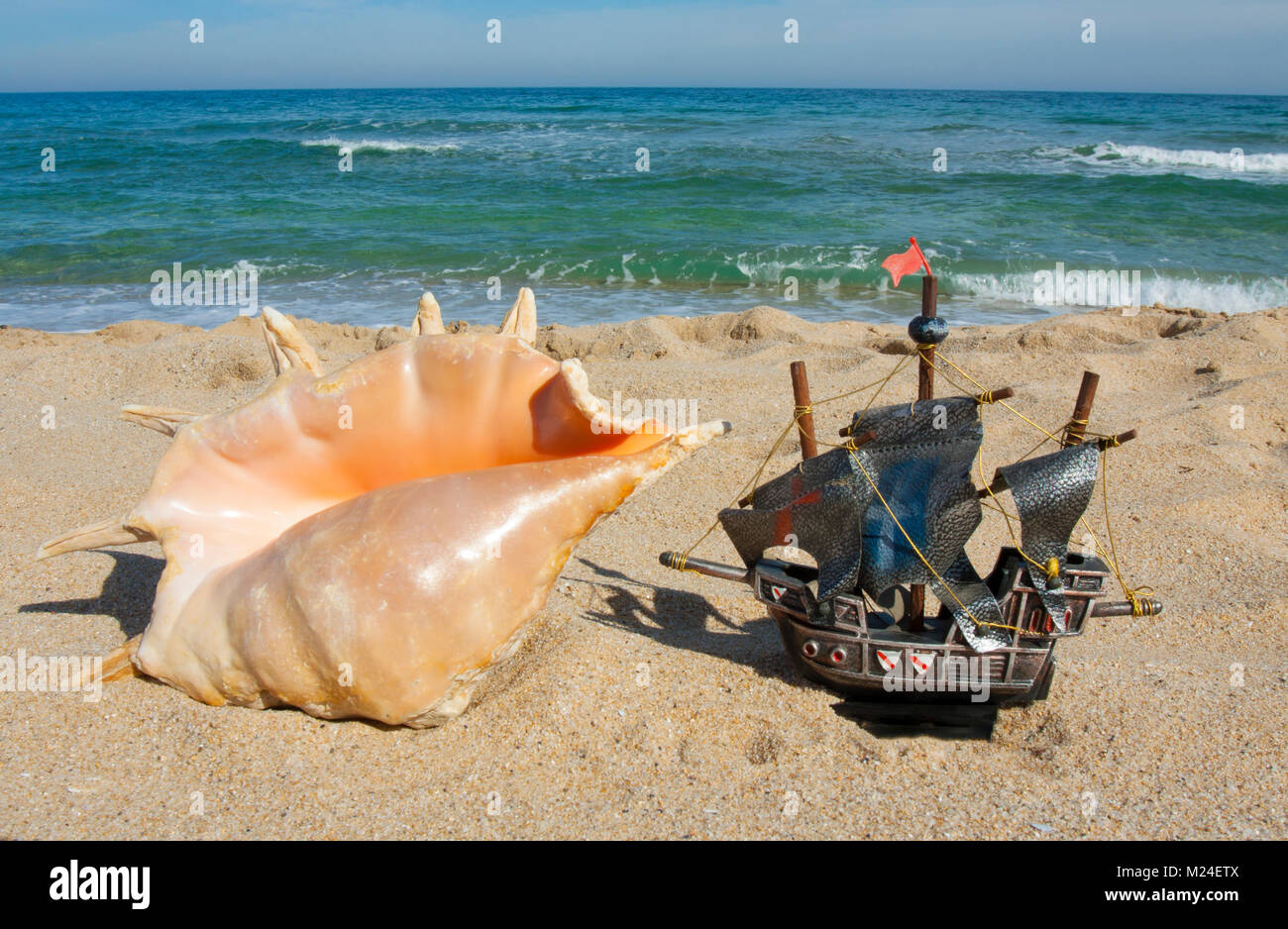 Shell and sailing ship Stock Photo - Alamy