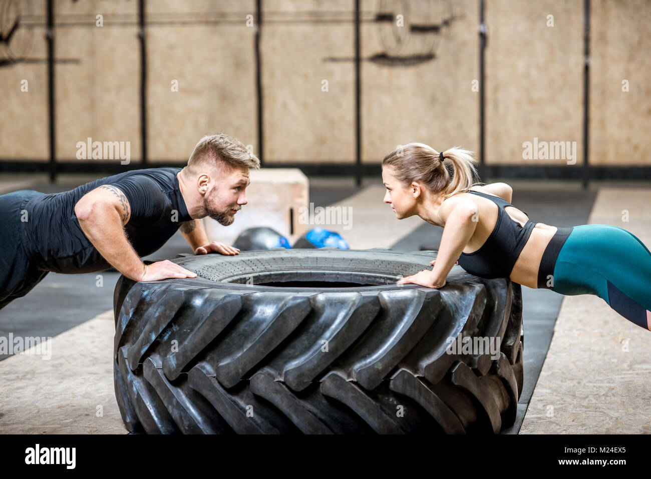 Couple pushing ups in the gym Stock Photo - Alamy