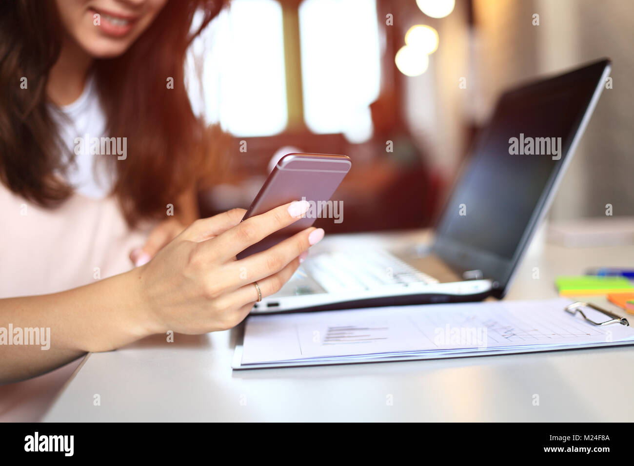 Woman worker relax with smartphone in work time Stock Photo - Alamy