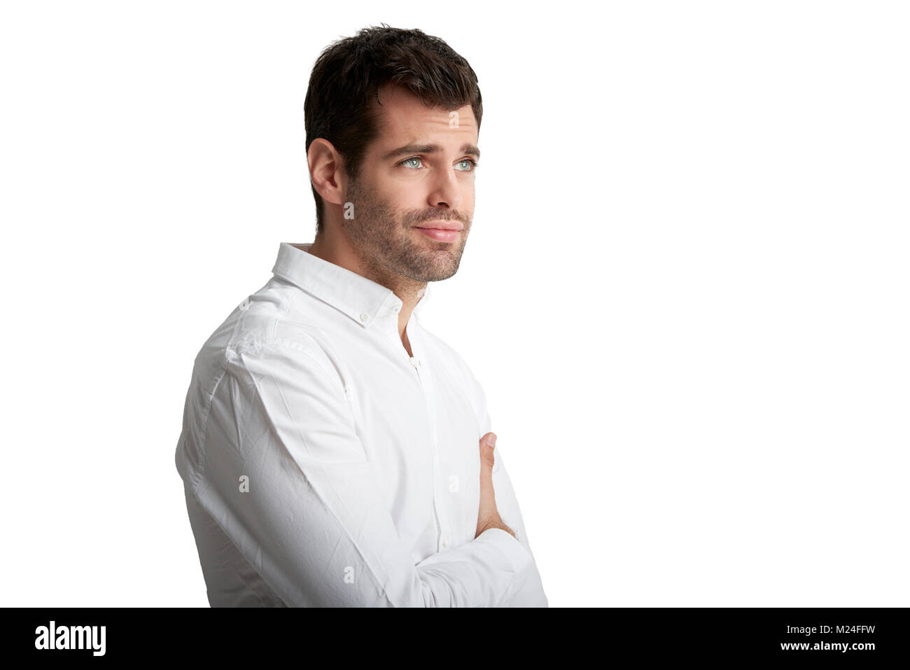 Worried young man standing against at isolated white background and ...