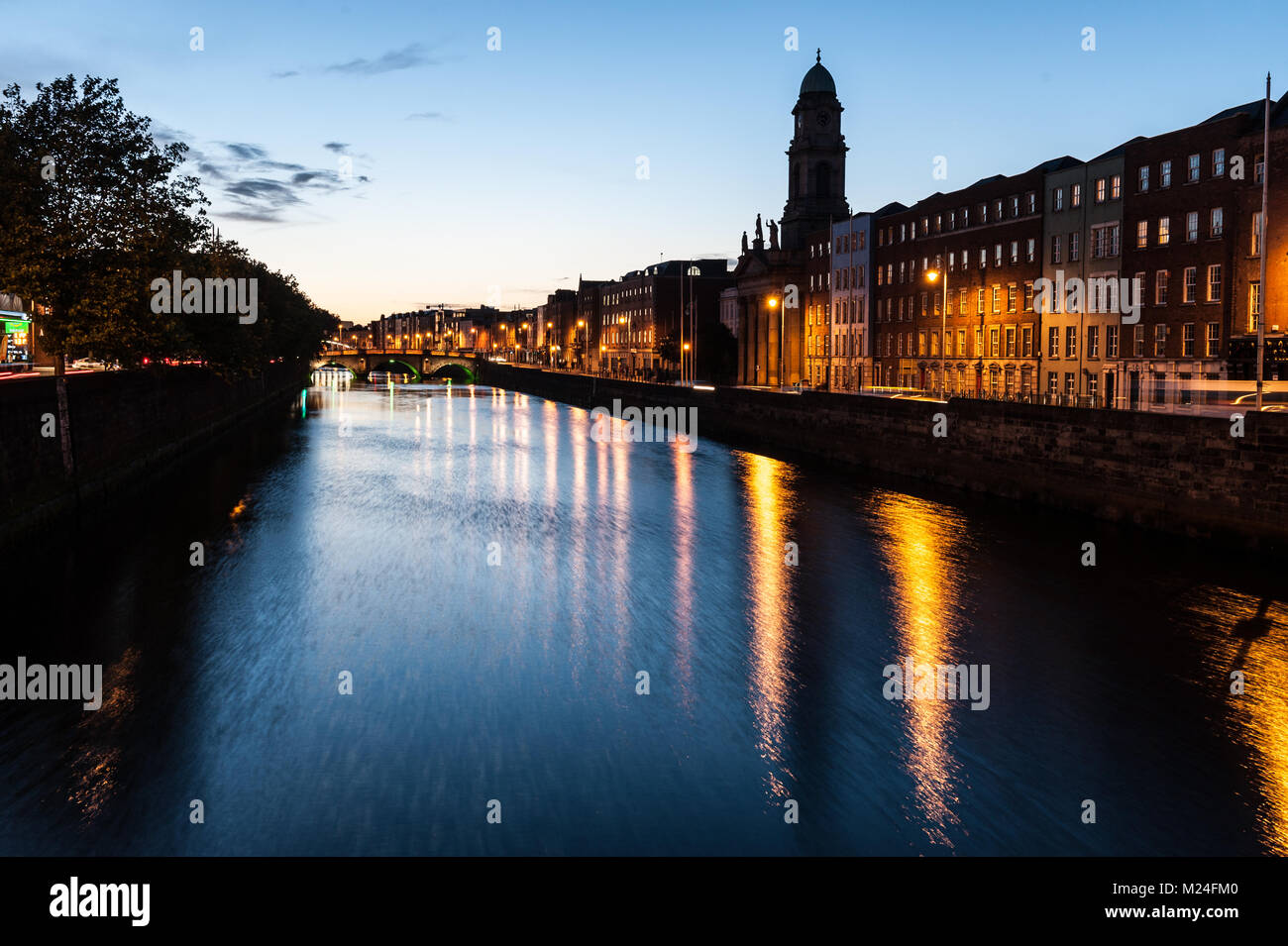 Dublin City at sunset with view over the river Liffey and historical ...