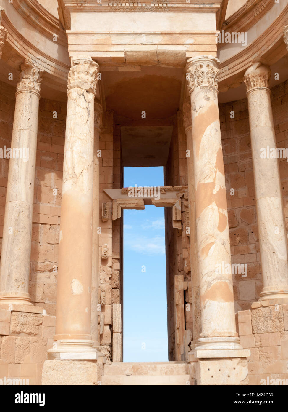 Roman ruins of Sabratha theater stage columns with blue sky Stock Photo ...