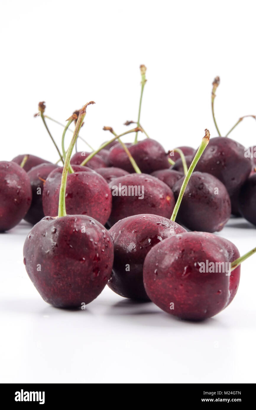 Sweet red cherries isolated on a white background Stock Photo - Alamy