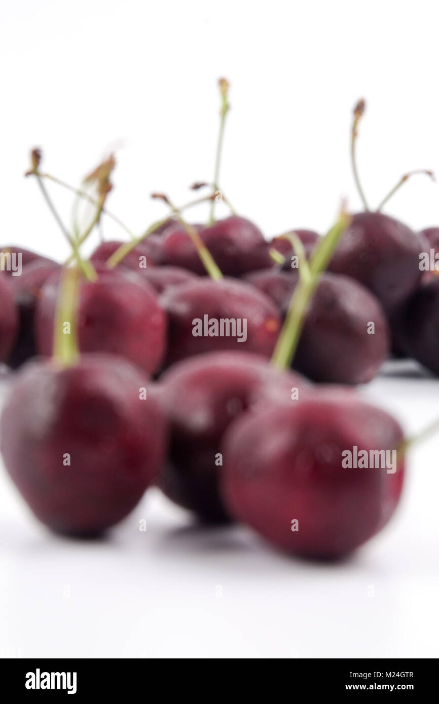 Sweet red cherries isolated on a white background Stock Photo - Alamy