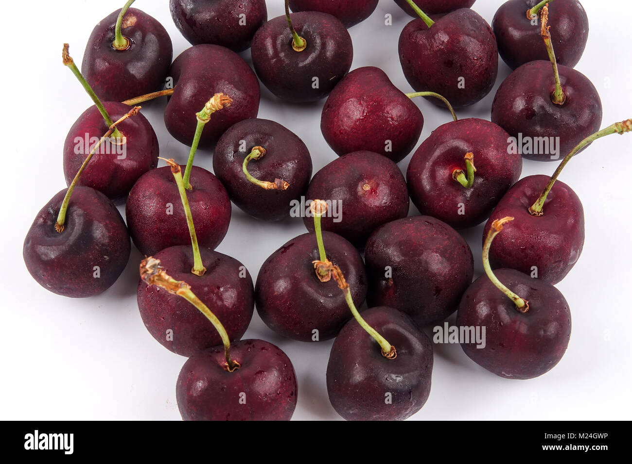 Sweet red cherries isolated on a white background Stock Photo - Alamy