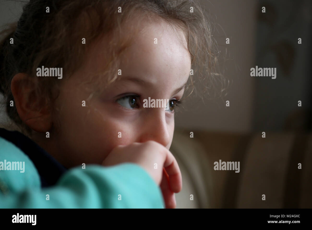 A young girl watching TV at home in Sussex, UK Stock Photo - Alamy