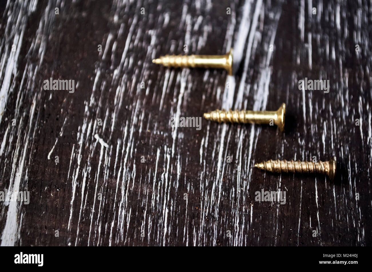 Screws to repair lying on the table. Men's housework. Fix the da Stock ...