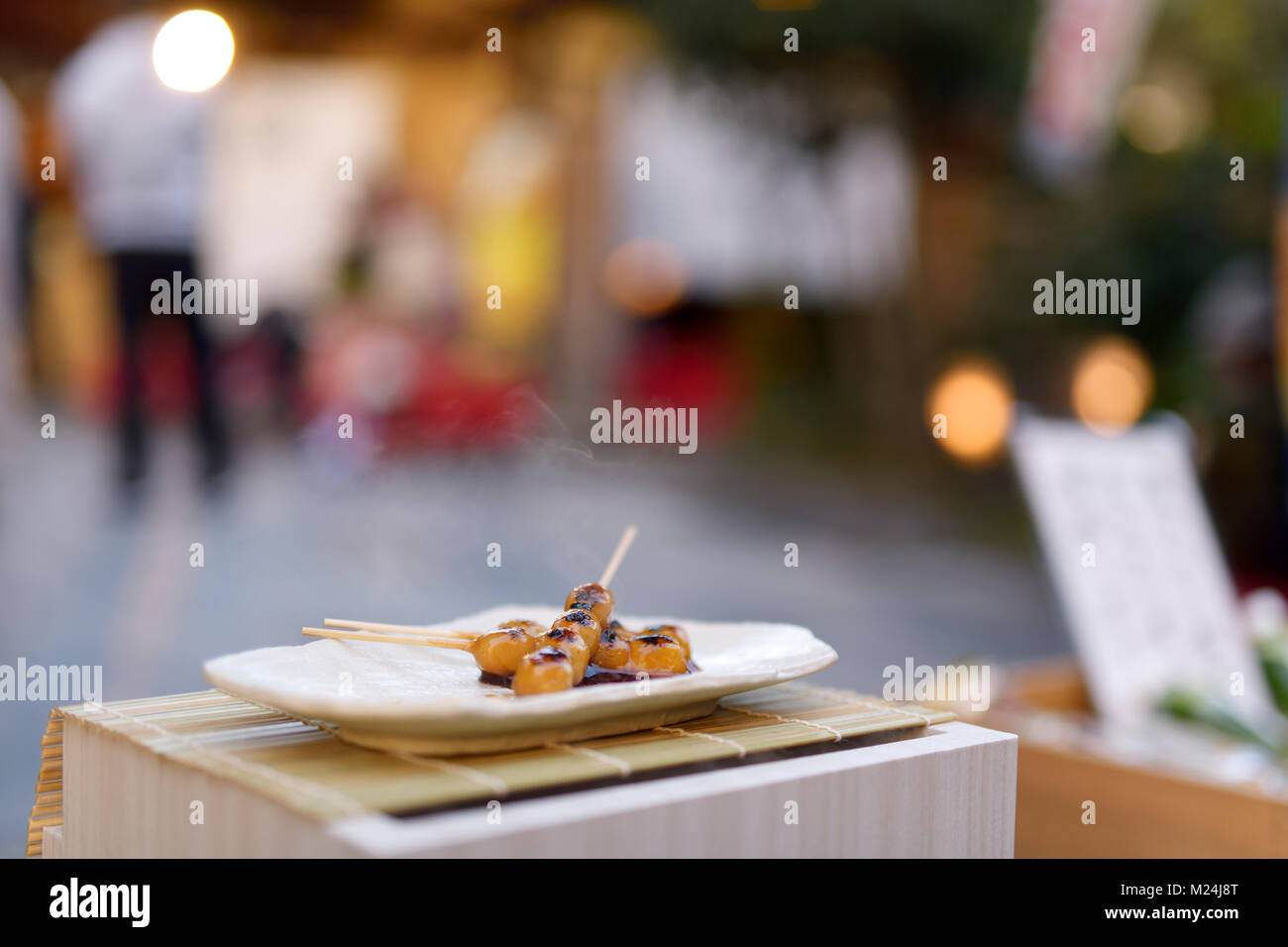 Mitarashi Dango, Japanese sweet dumplings on a stick, grilled small ...