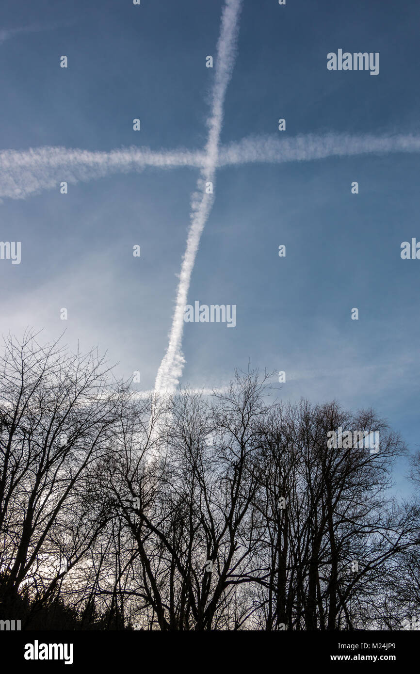 Contrails in the blue sky Stock Photo - Alamy