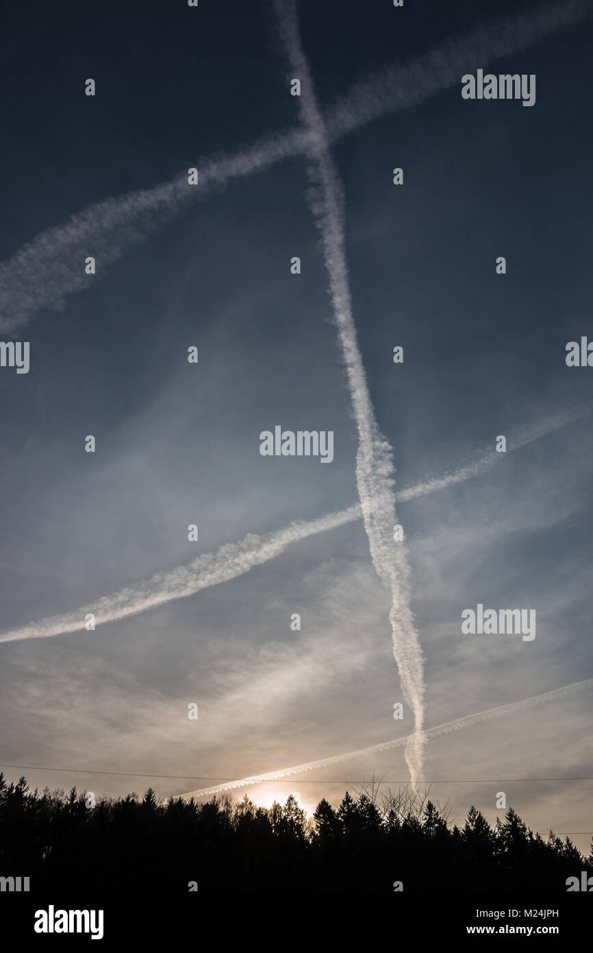 Contrails in the blue sky Stock Photo - Alamy