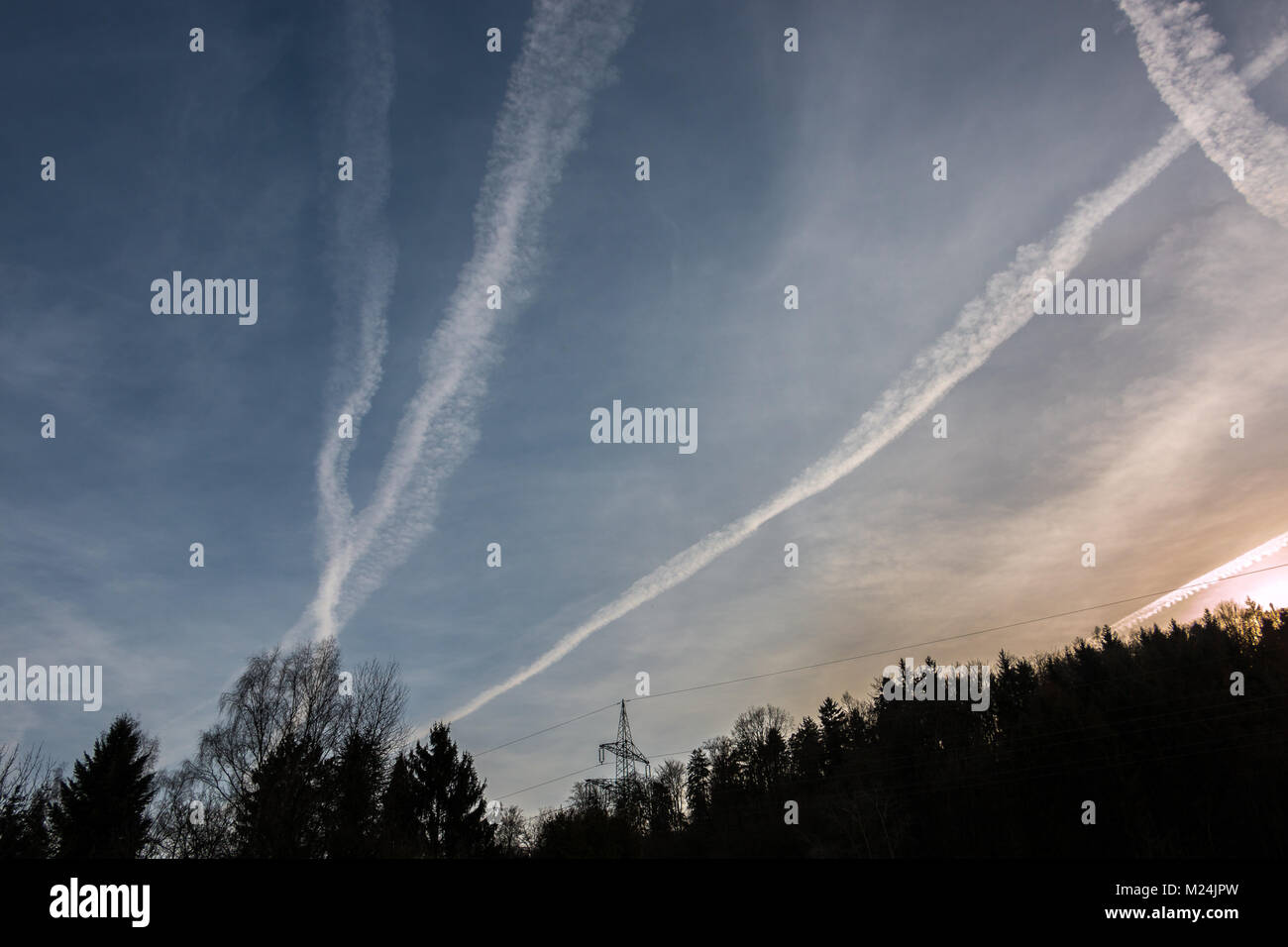 Contrails in the blue sky Stock Photo - Alamy