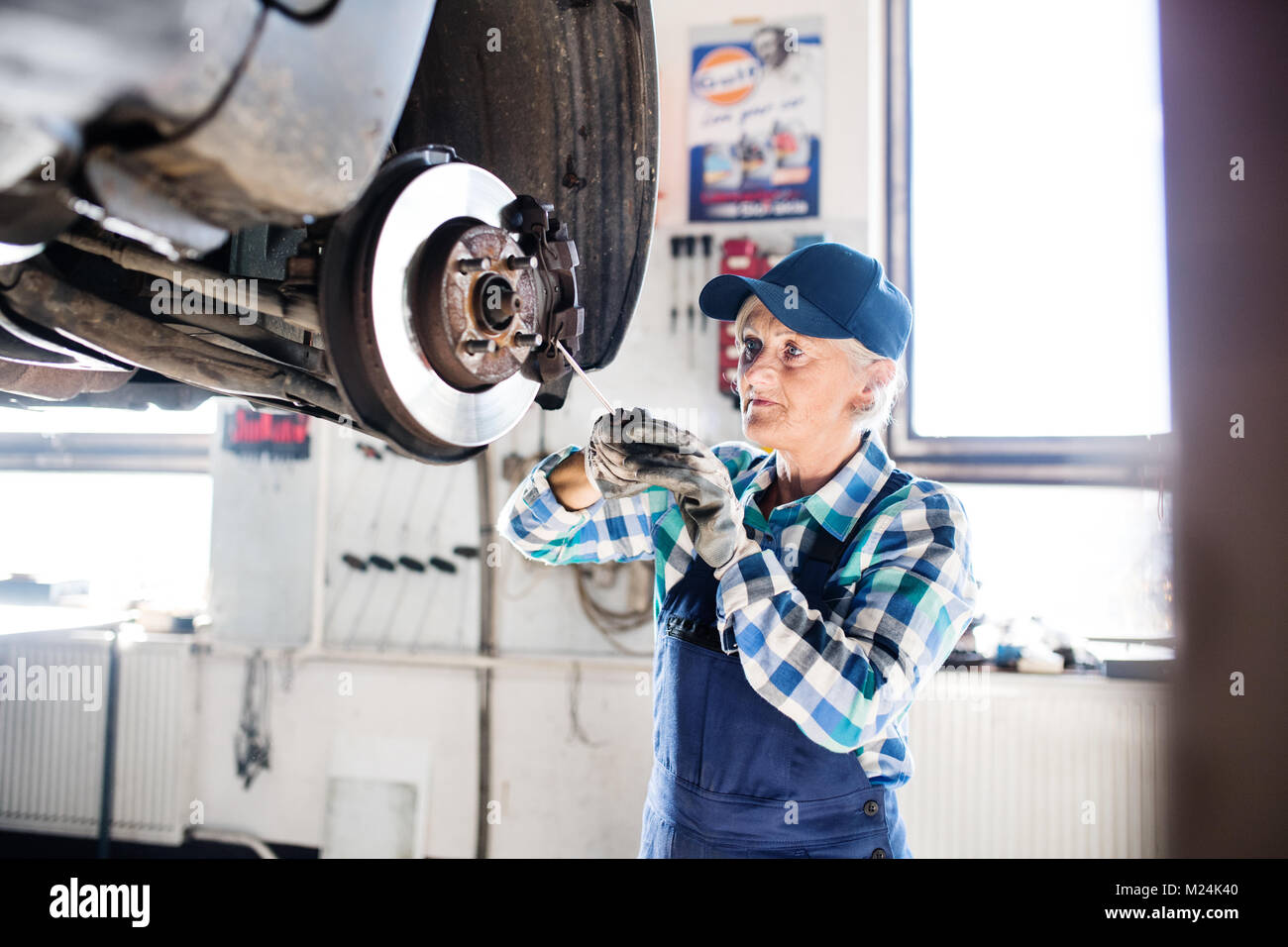 Woman Garage Car Repairing High Resolution Stock Photography and Images ...