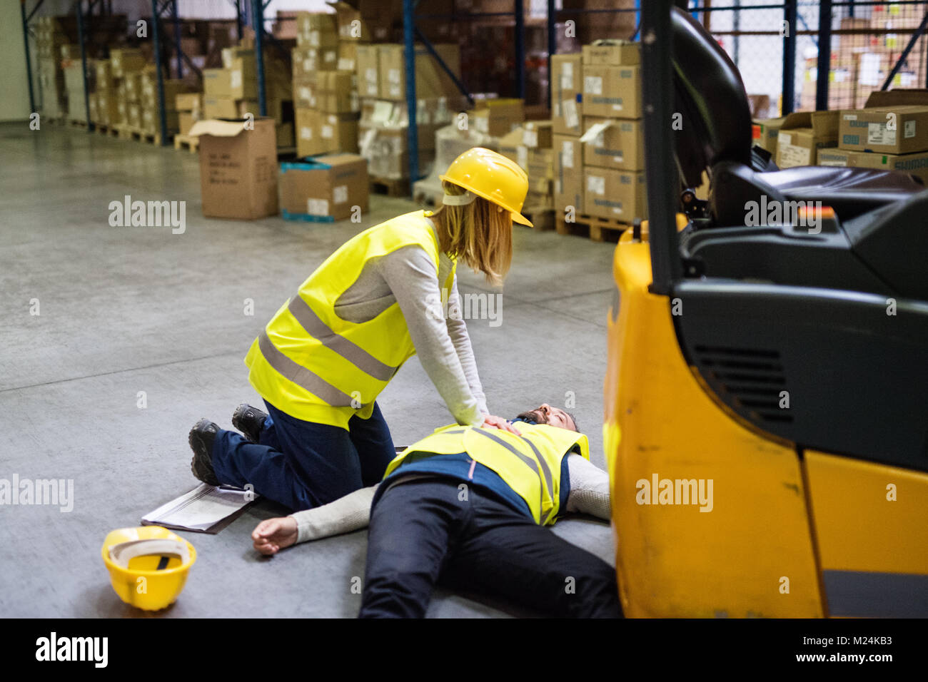 Warehouse workers after an accident in a warehouse Stock Photo - Alamy
