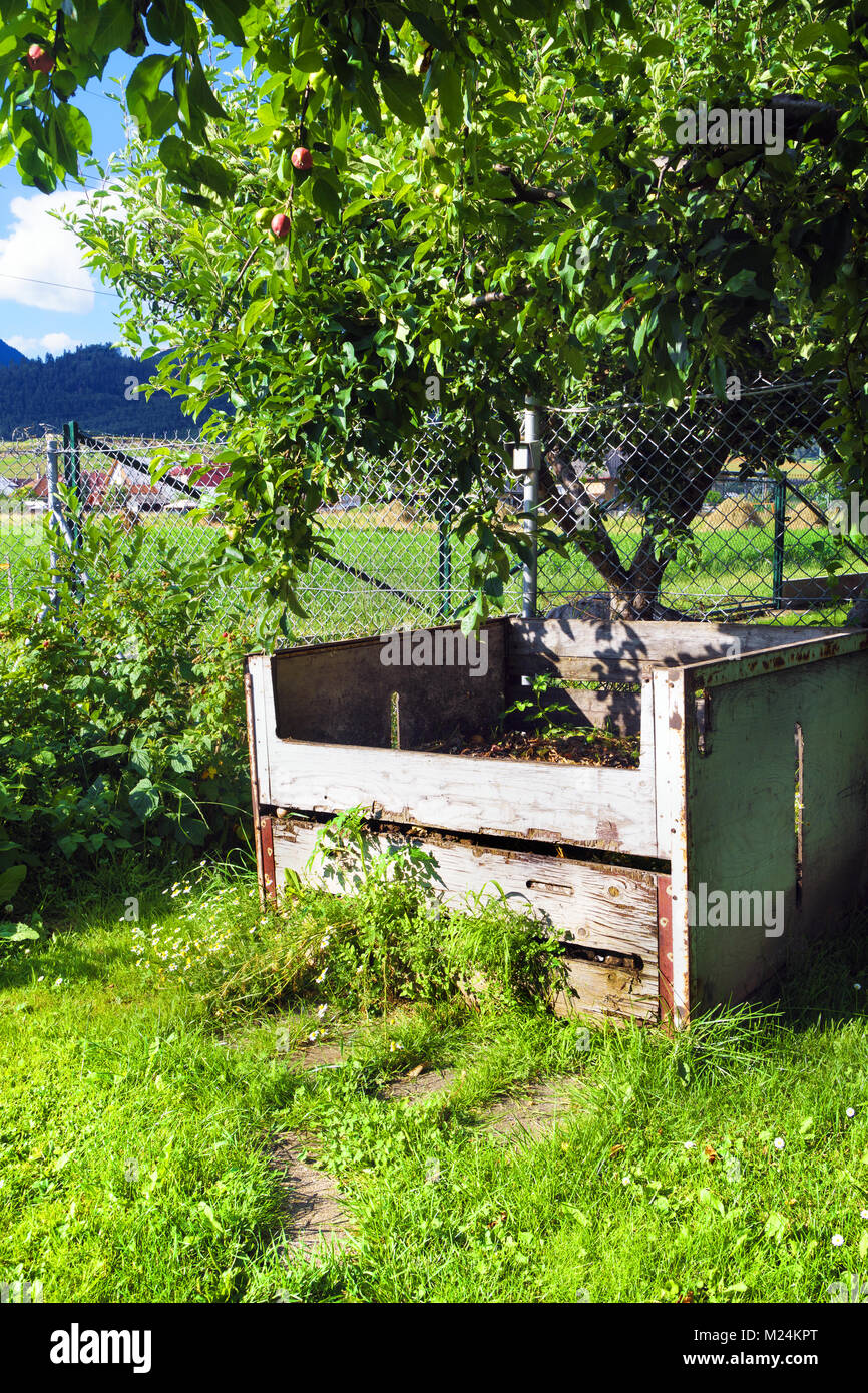 Composting in the garden under the tree Stock Photo - Alamy