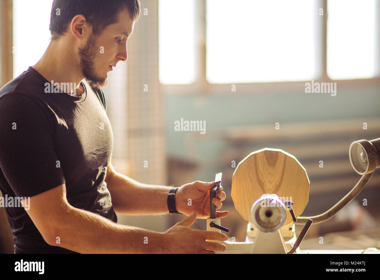 attractive man begin doing woodwork in carpentry Stock Photo - Alamy
