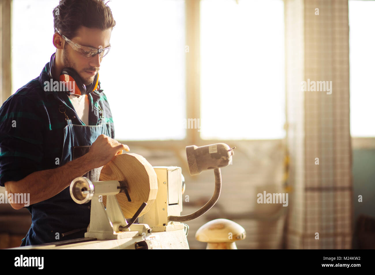attractive man begin doing woodwork in carpentry Stock Photo - Alamy