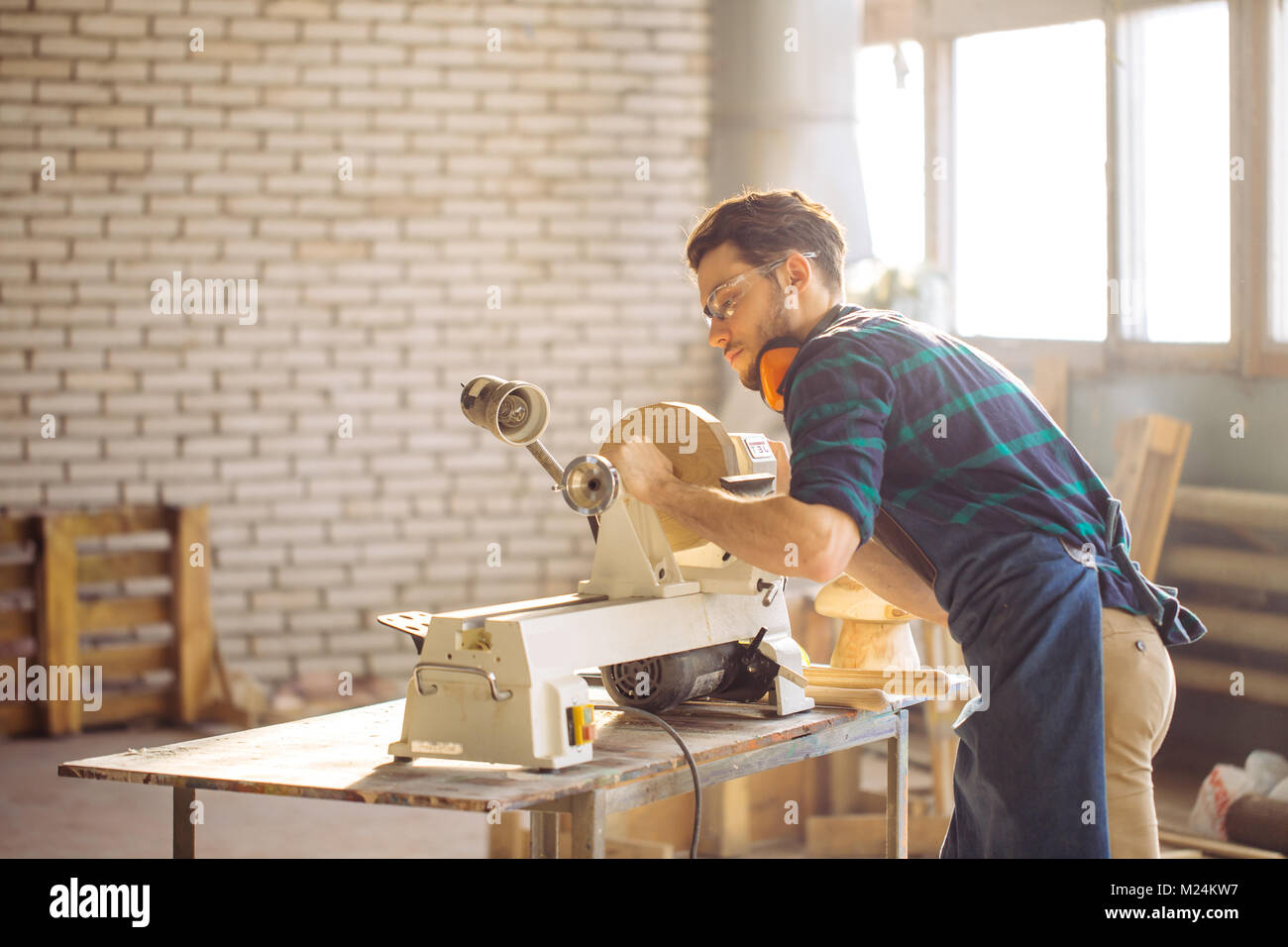 attractive man begin doing woodwork in carpentry Stock Photo - Alamy