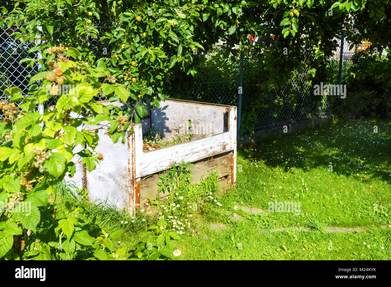 Composting in the garden under the tree Stock Photo - Alamy