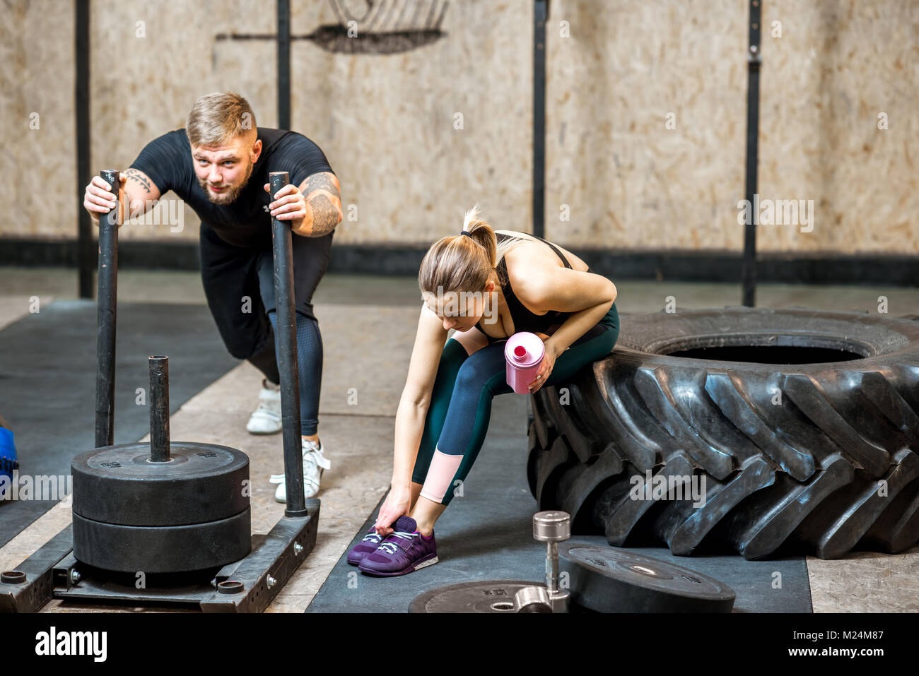 Man pushing sled in the gym Stock Photo - Alamy