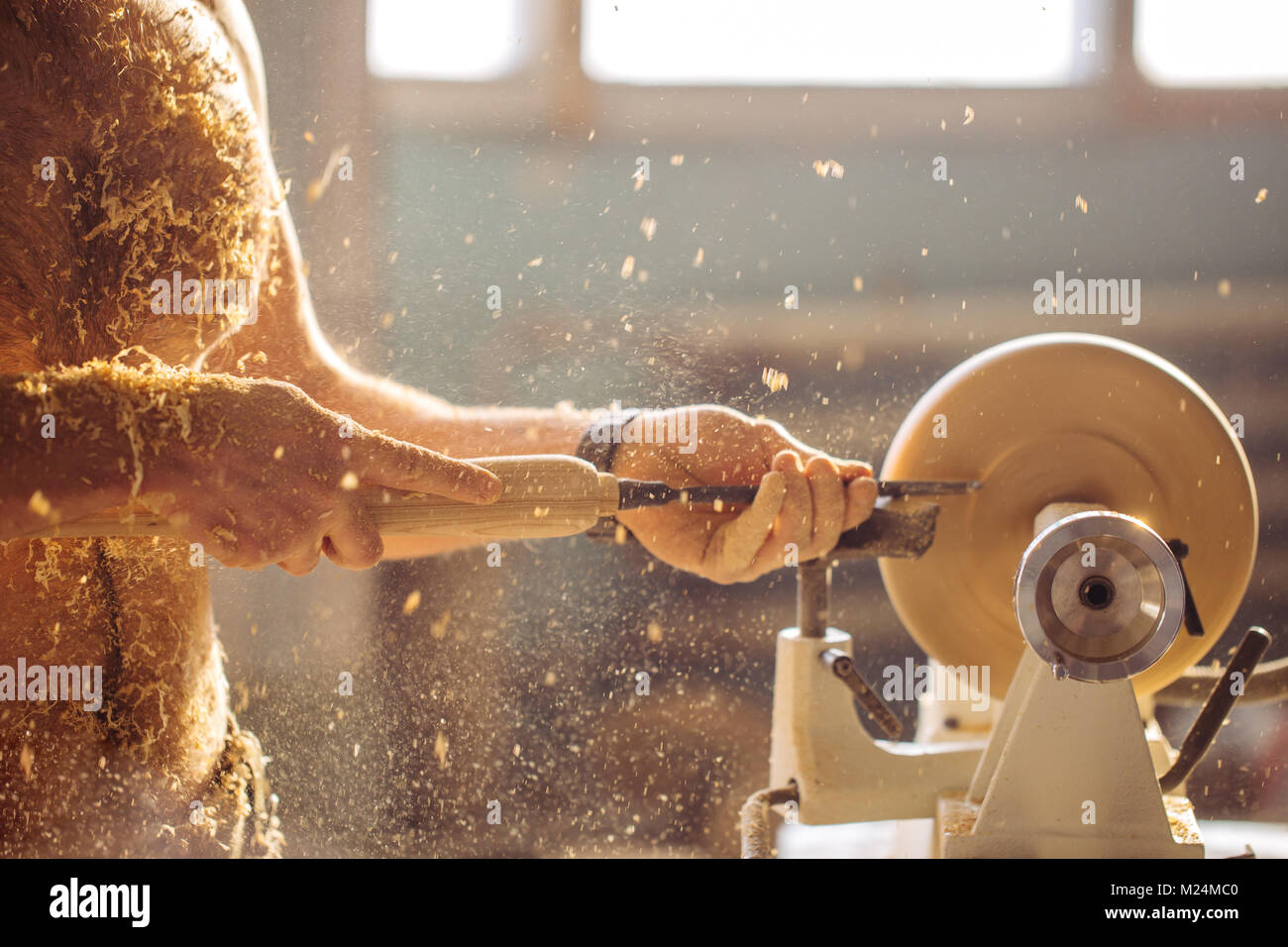 Wood lathe. Carpenter lathing wood Stock Photo - Alamy