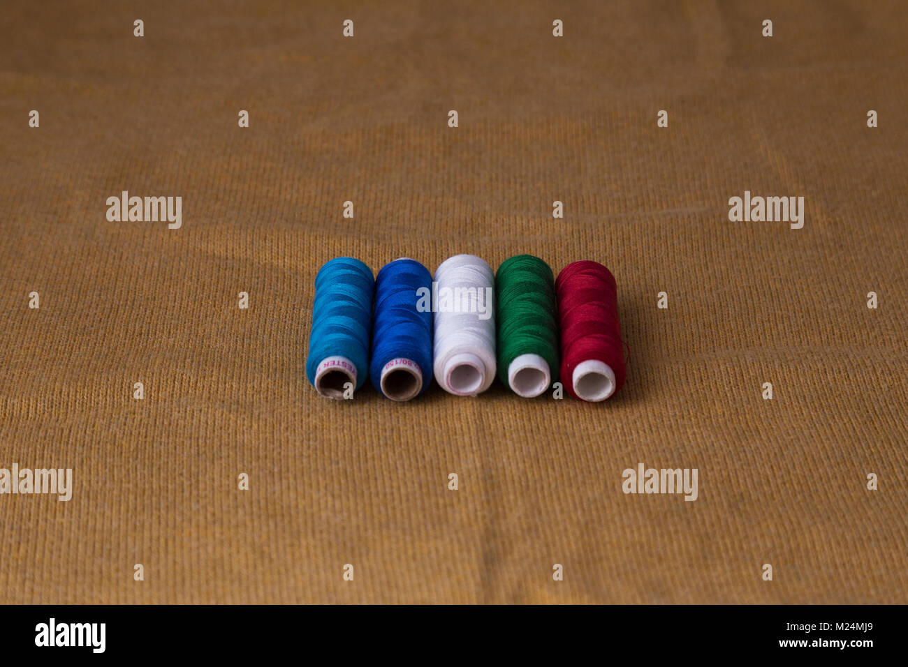 Red and white coloured threads hi-res stock photography and images - Alamy