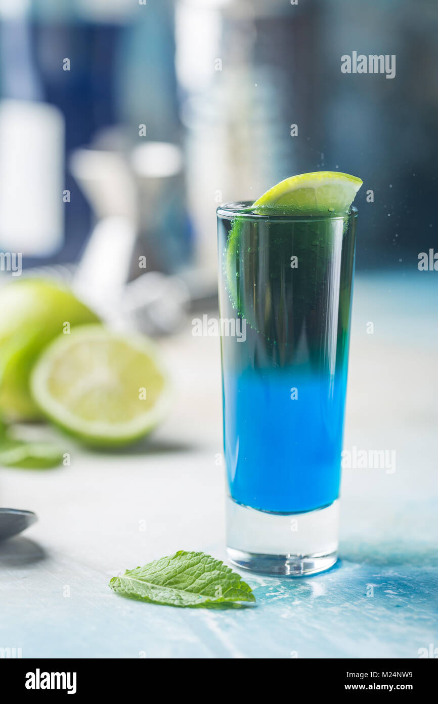 A blue layer alcoholic cocktail Stock Photo - Alamy