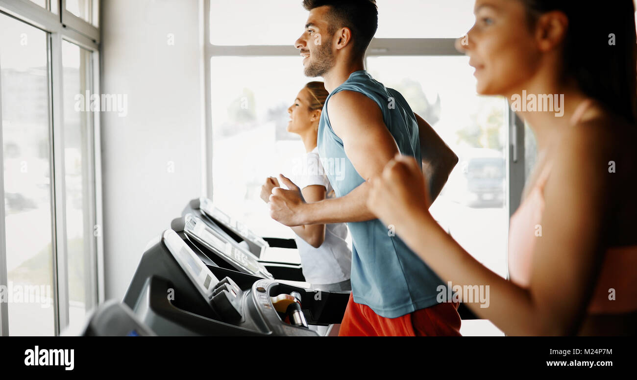 Picture of people running on treadmill in gym Stock Photo - Alamy