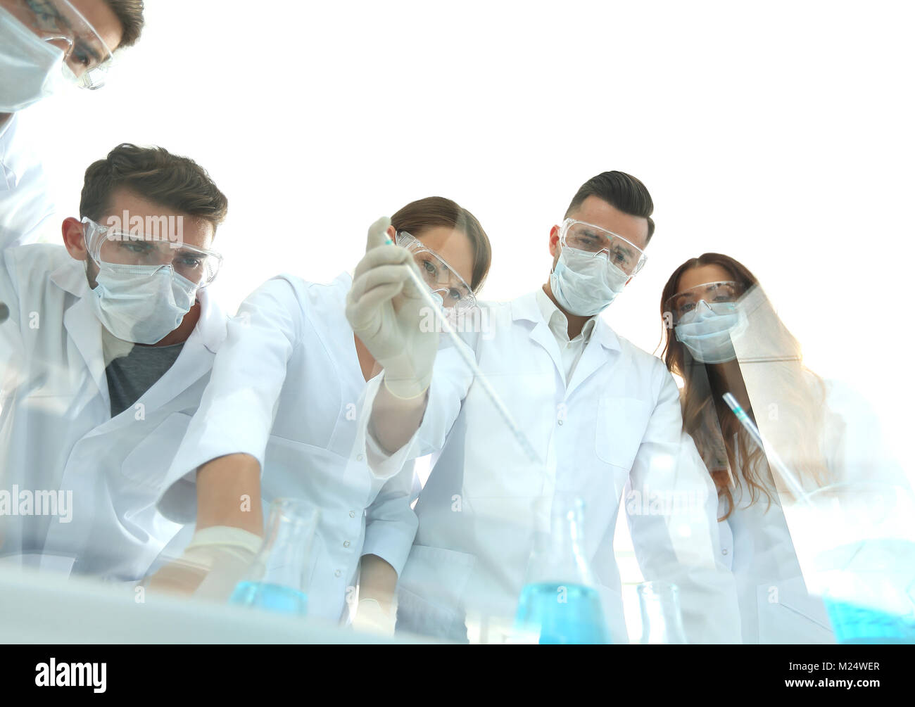 scientists working with test tubes and microscope in the laboratory ...