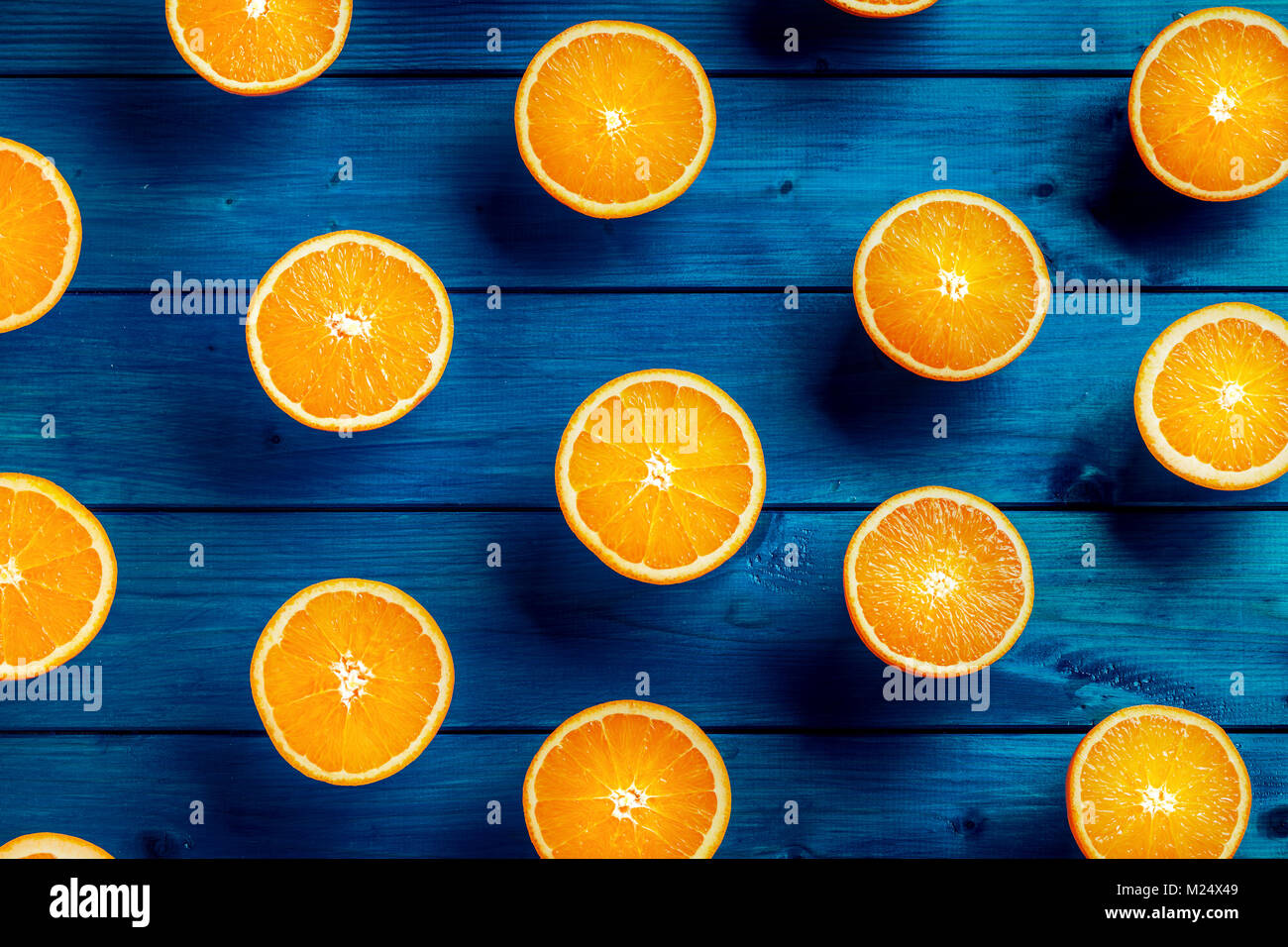 Orange. Top of view cut fresh oranges on a blue table Stock Photo - Alamy