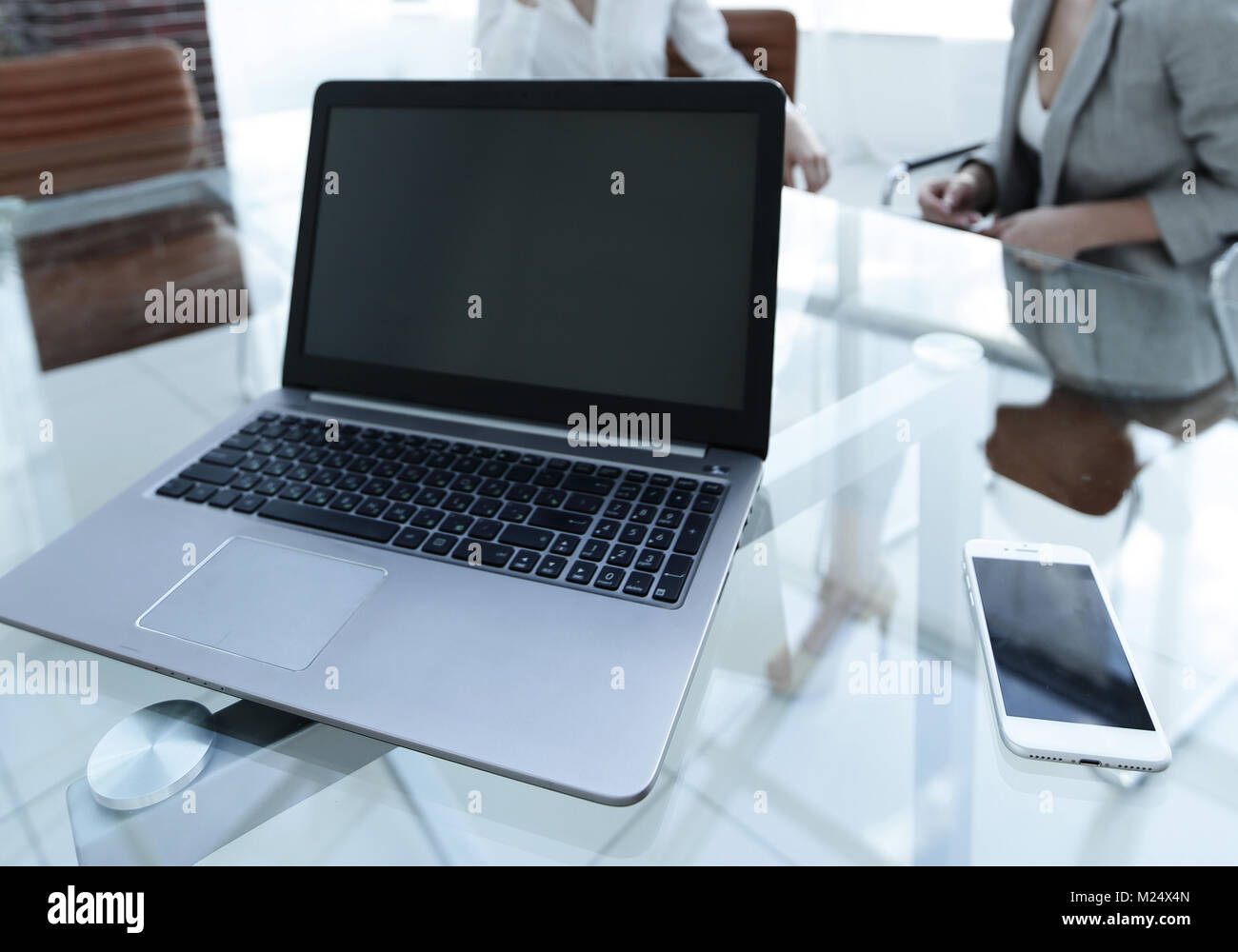laptop and a smartphone on the desktop of a businessman Stock Photo - Alamy