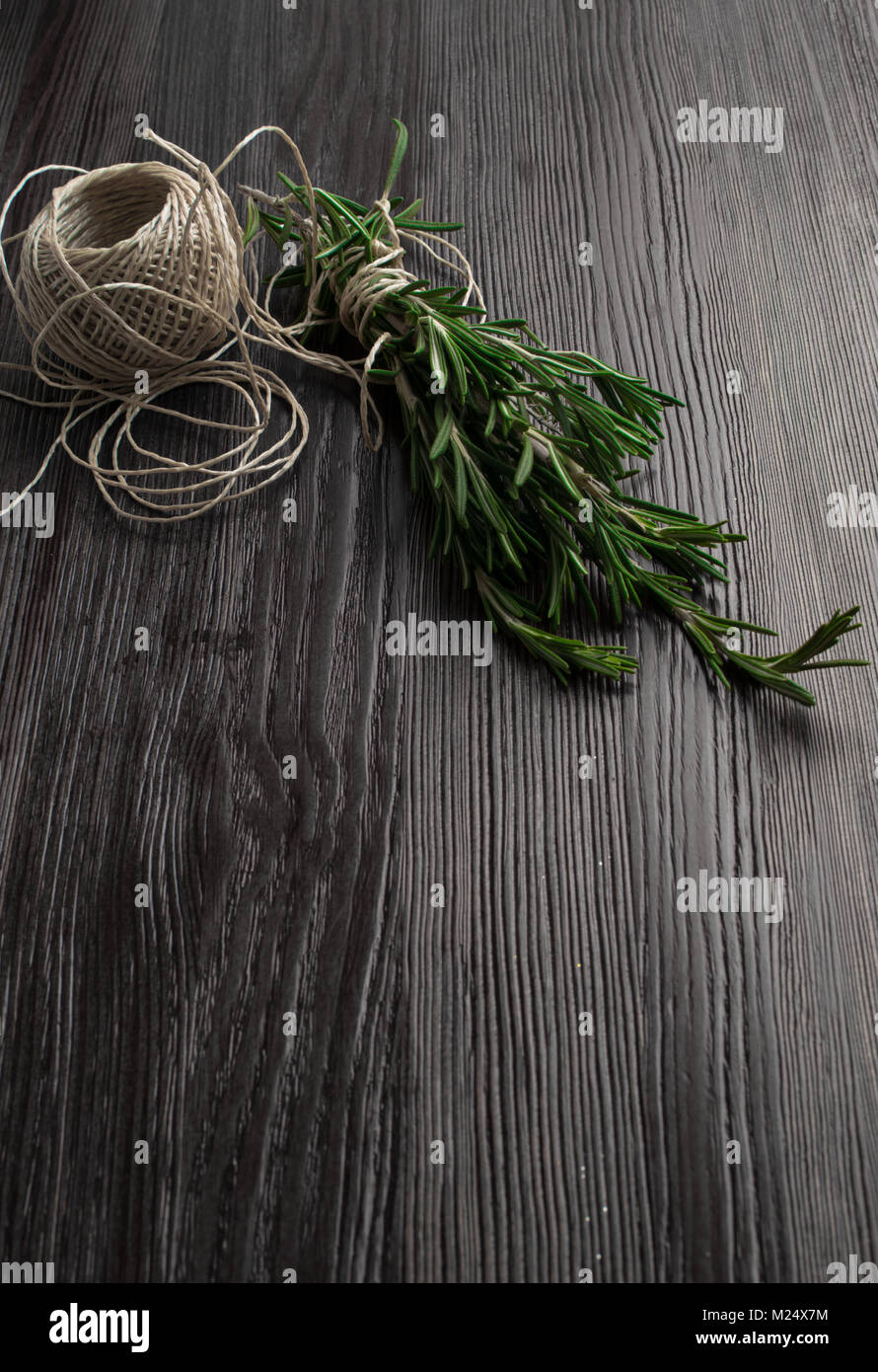 organic green rosemary branch on the table Stock Photo - Alamy