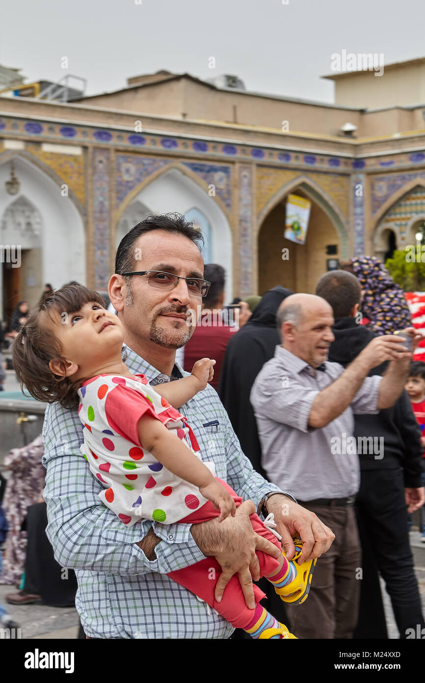 Tehran, Iran - April 27, 2017: an Iranian man with a small daughter in ...