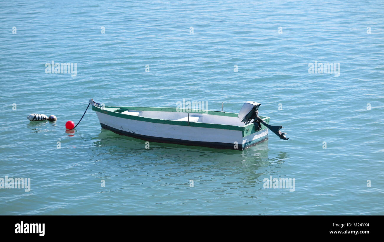 horizontal view of a small wooden boat anchored in the sea Stock Photo ...