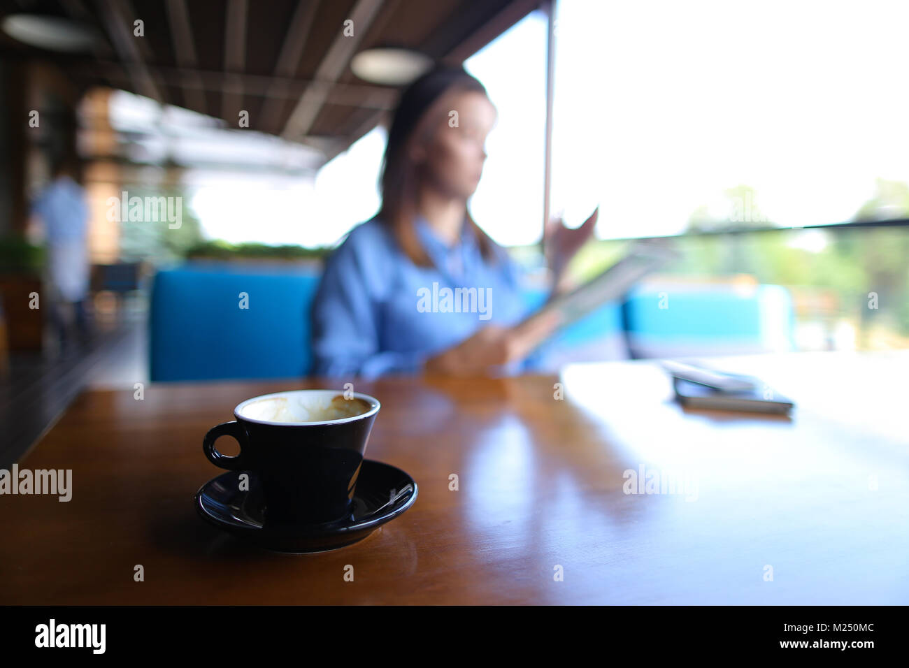 Pretty woman reading menu at restaurant with close up face Stock Photo ...