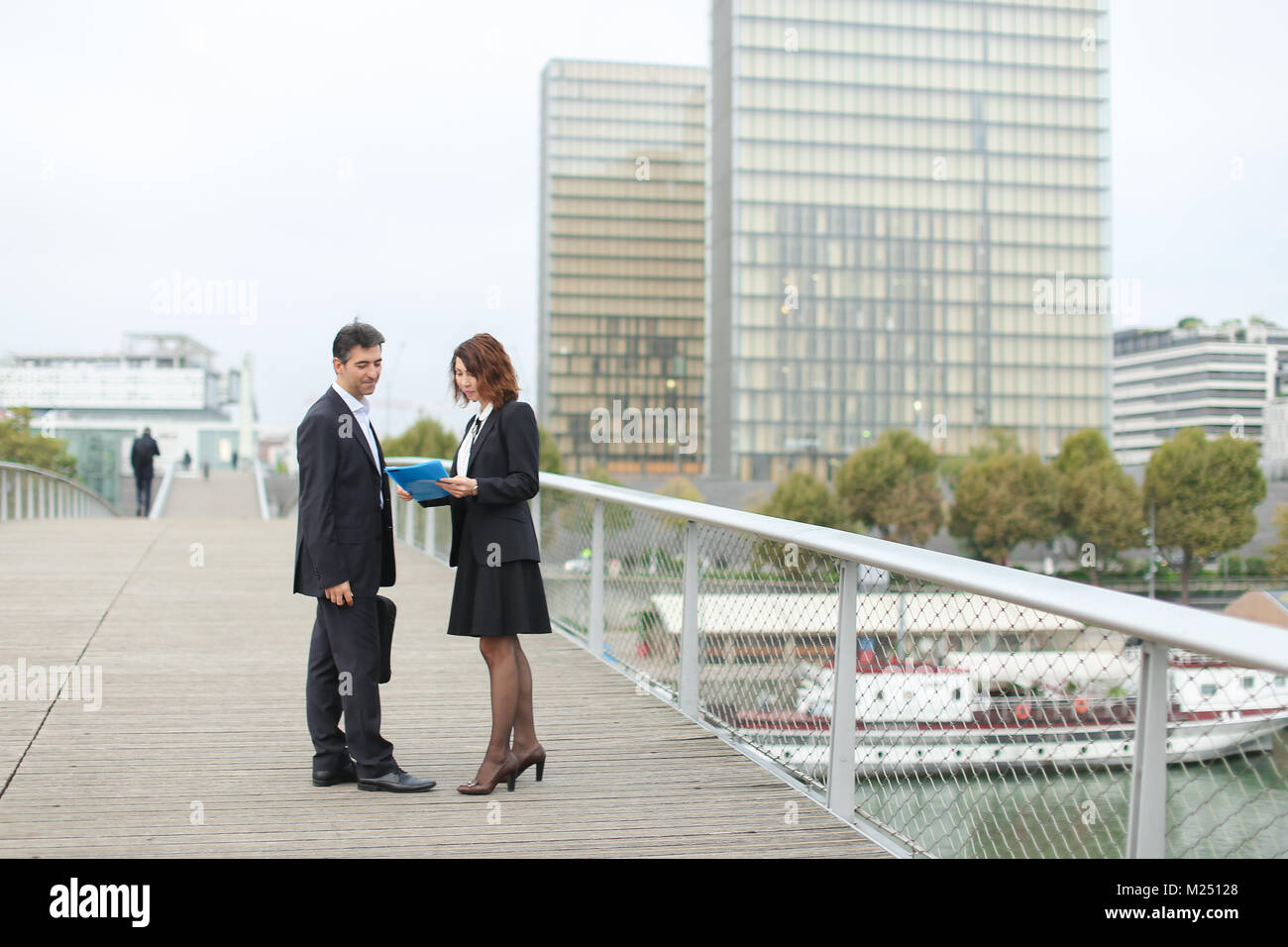 economists male and female in strict suits walking Stock Photo - Alamy