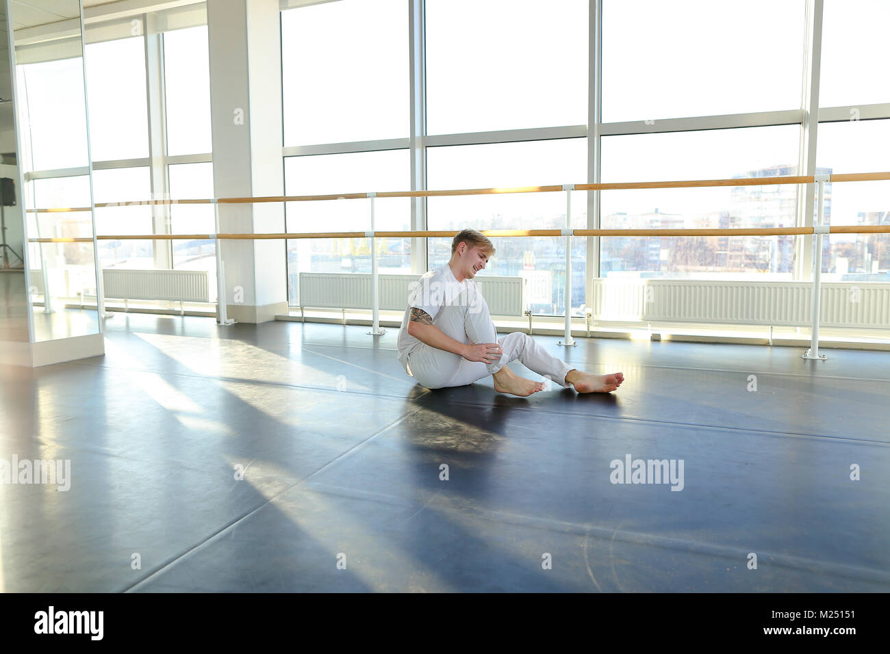 Man raising legs high at studio Stock Photo - Alamy