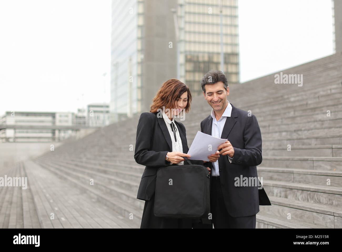 male lawyer speaking with female client Stock Photo - Alamy