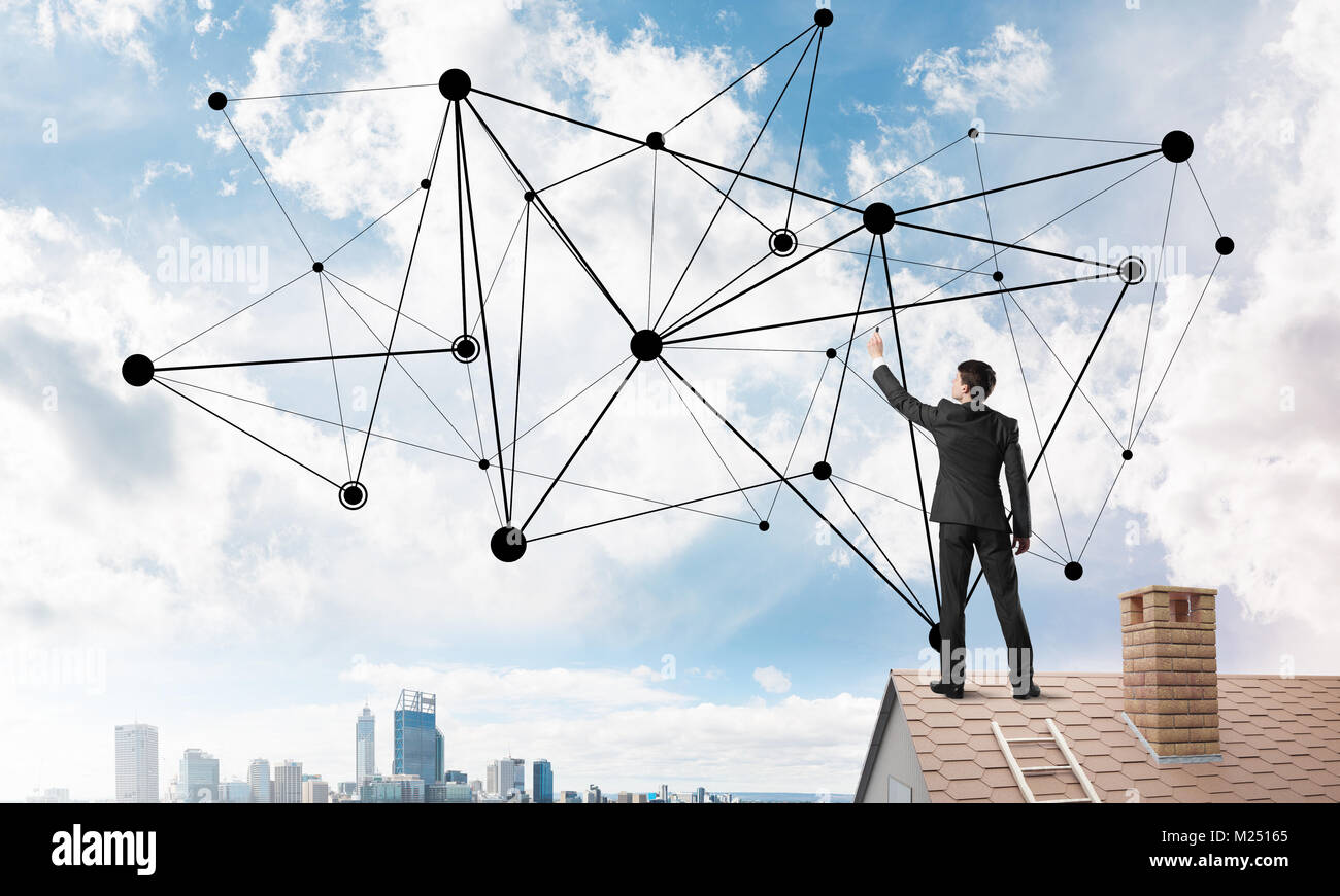 Businessman on house roof presenting networking and connection concept ...